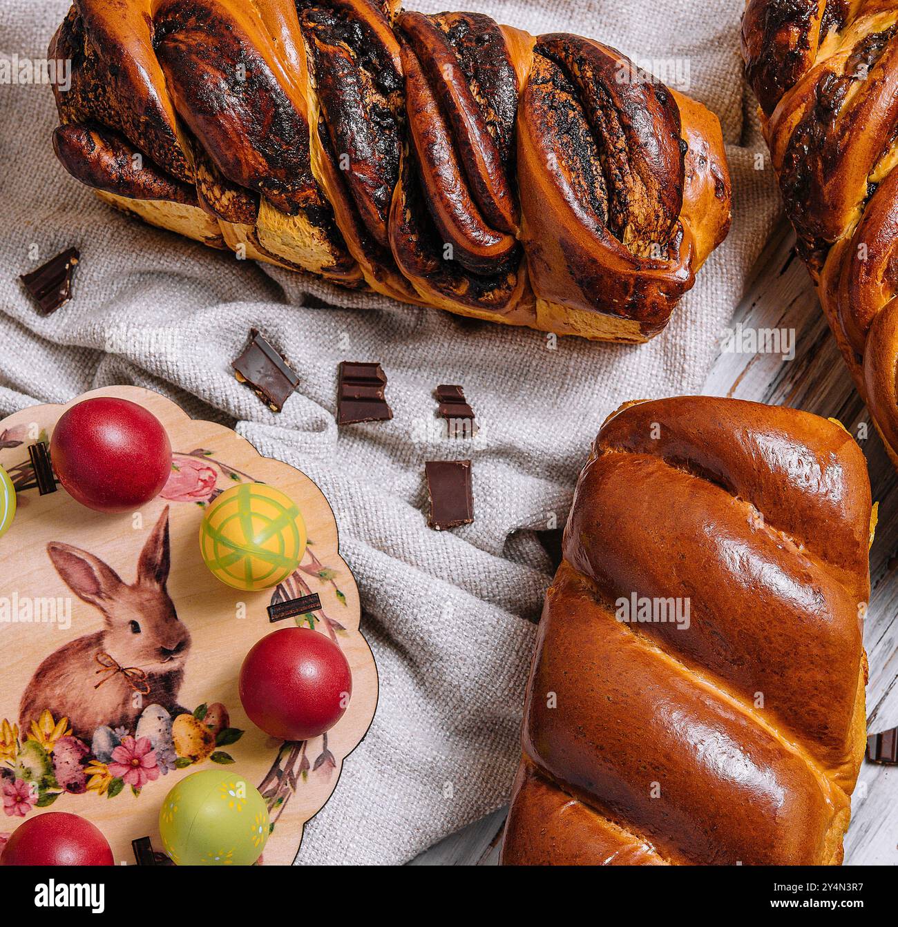 Easter eggs with buns on top view Stock Photo - Alamy