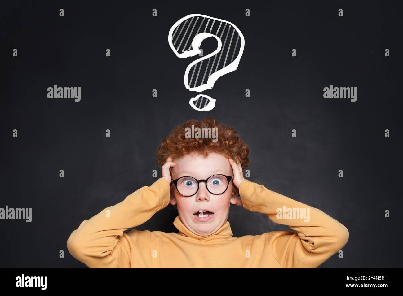 Stressed child boy school student with question mark on blackboard ...