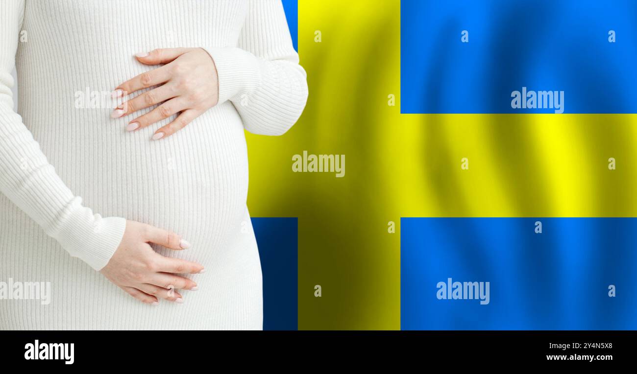Pregnant woman belly against Swedish flag background. Demographics and ...