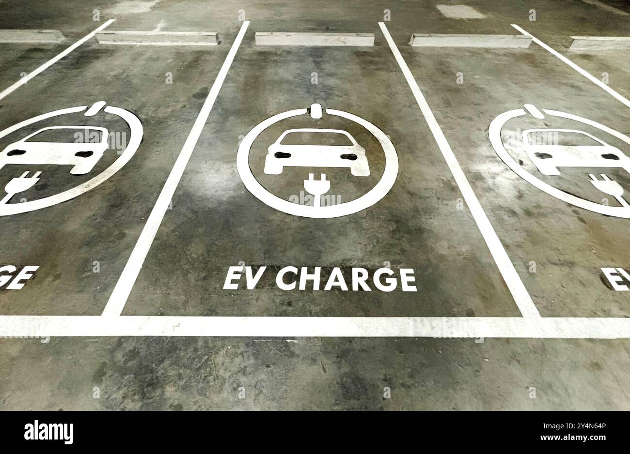 Empty space of EV charge parking lots in a business building, sign of ...