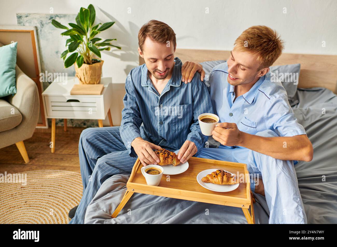 Two men enjoy a lovely morning together, sharing breakfast in their ...