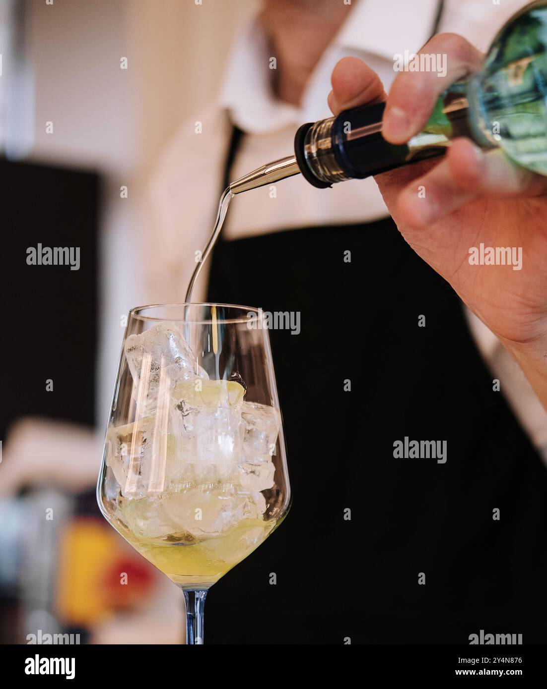 Man pours drink cocktail glass hi-res stock photography and images - Alamy