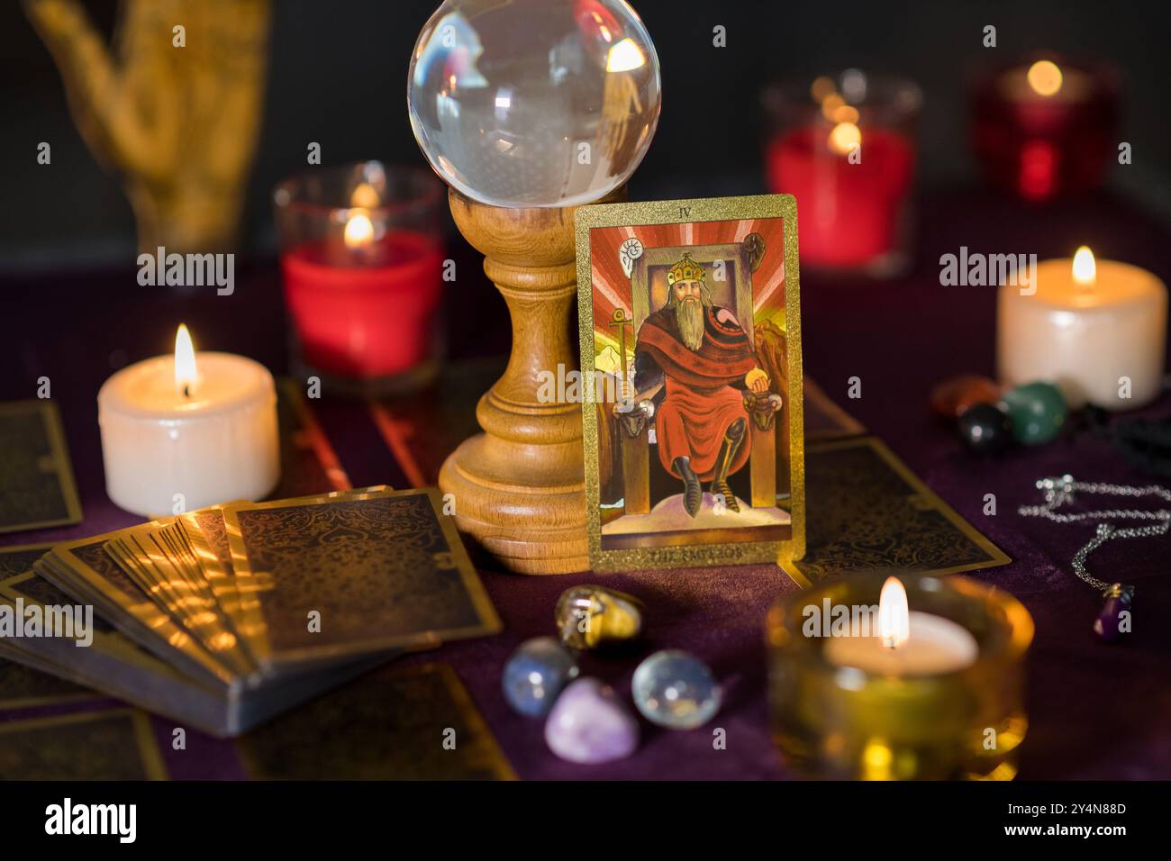Tarot card setup with candles and a crystal ball for esoteric and ...