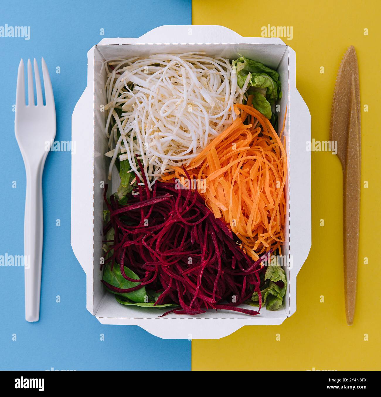 Slice fresh vegetables on launch box Stock Photo - Alamy