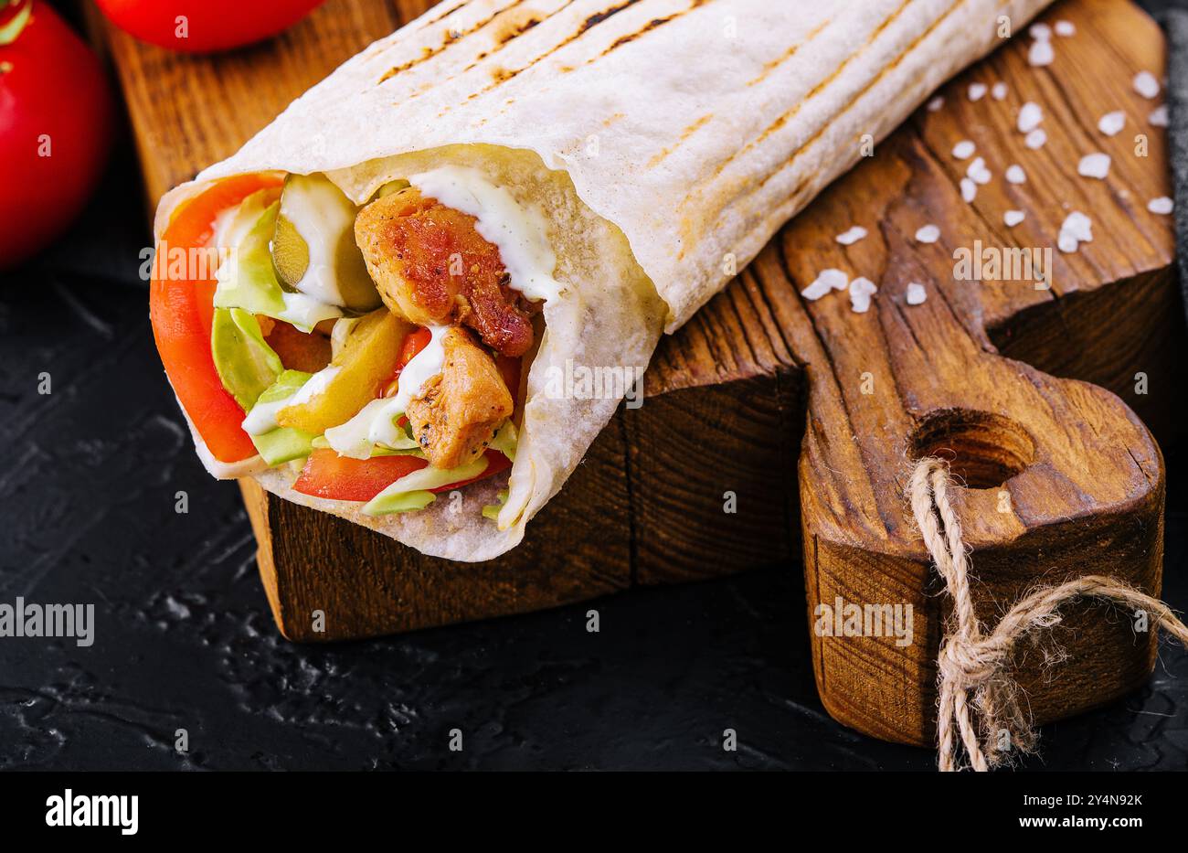 Shawarma rolled in lavash, moist grilled meat Stock Photo - Alamy