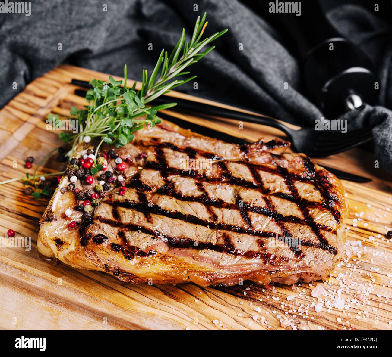 Grilled striploin sliced steak on cutting board Stock Photo - Alamy