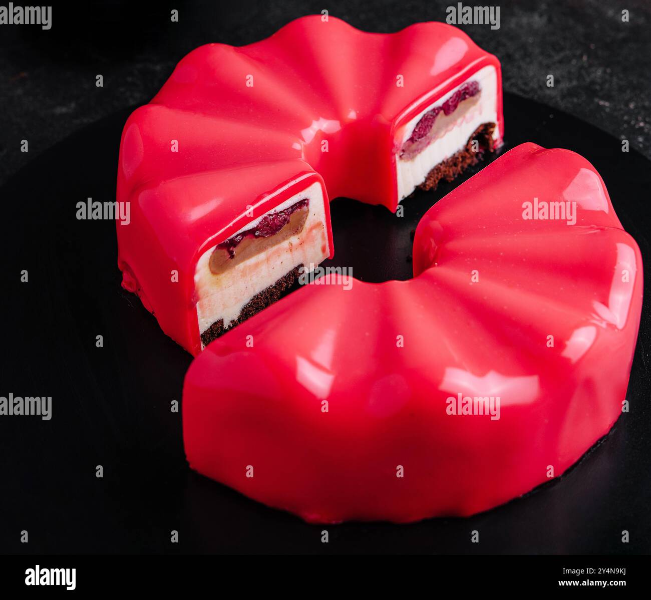 Multi layered raspberry mousse cake on plate Stock Photo - Alamy