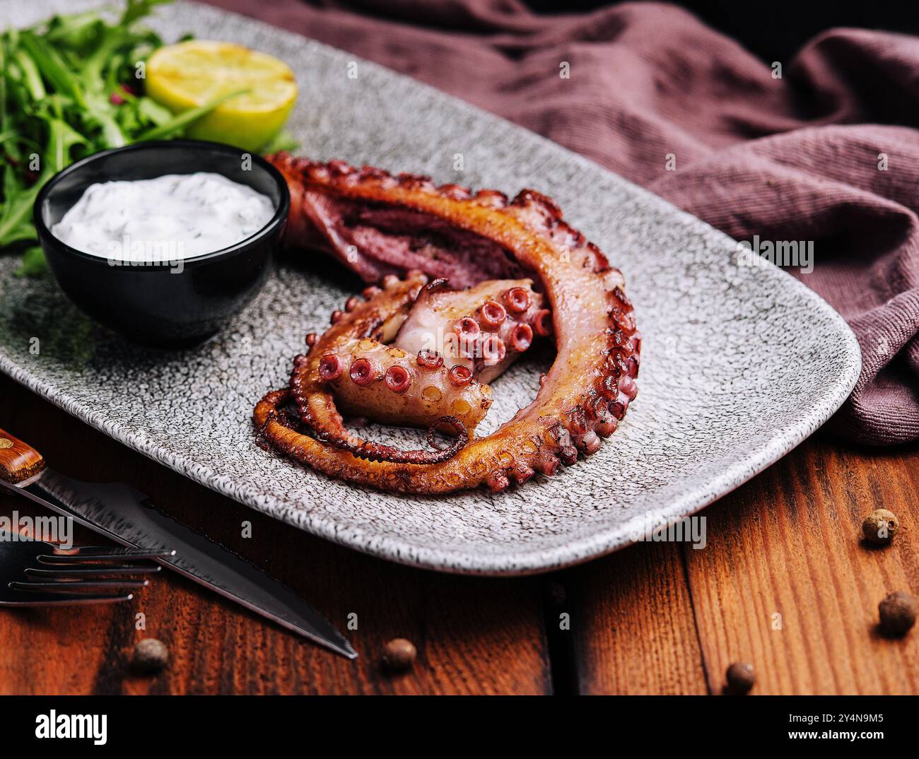 Traditional french octopus braised cooked with salicornia, lemon curd ...