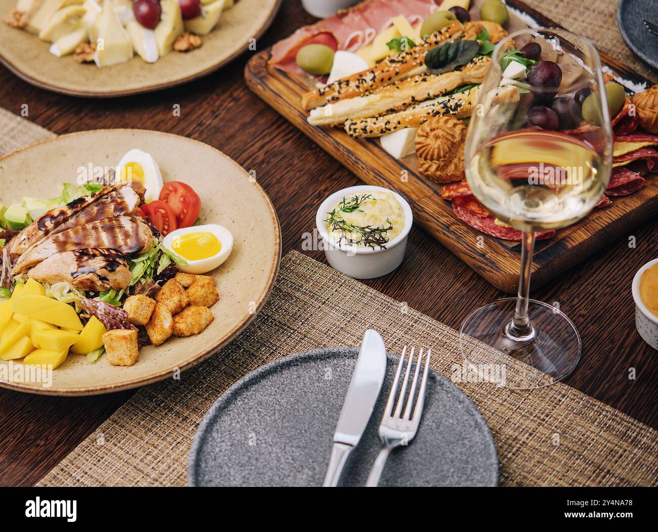 Italian appetizer - various types of ham, cheese and grissini Stock ...