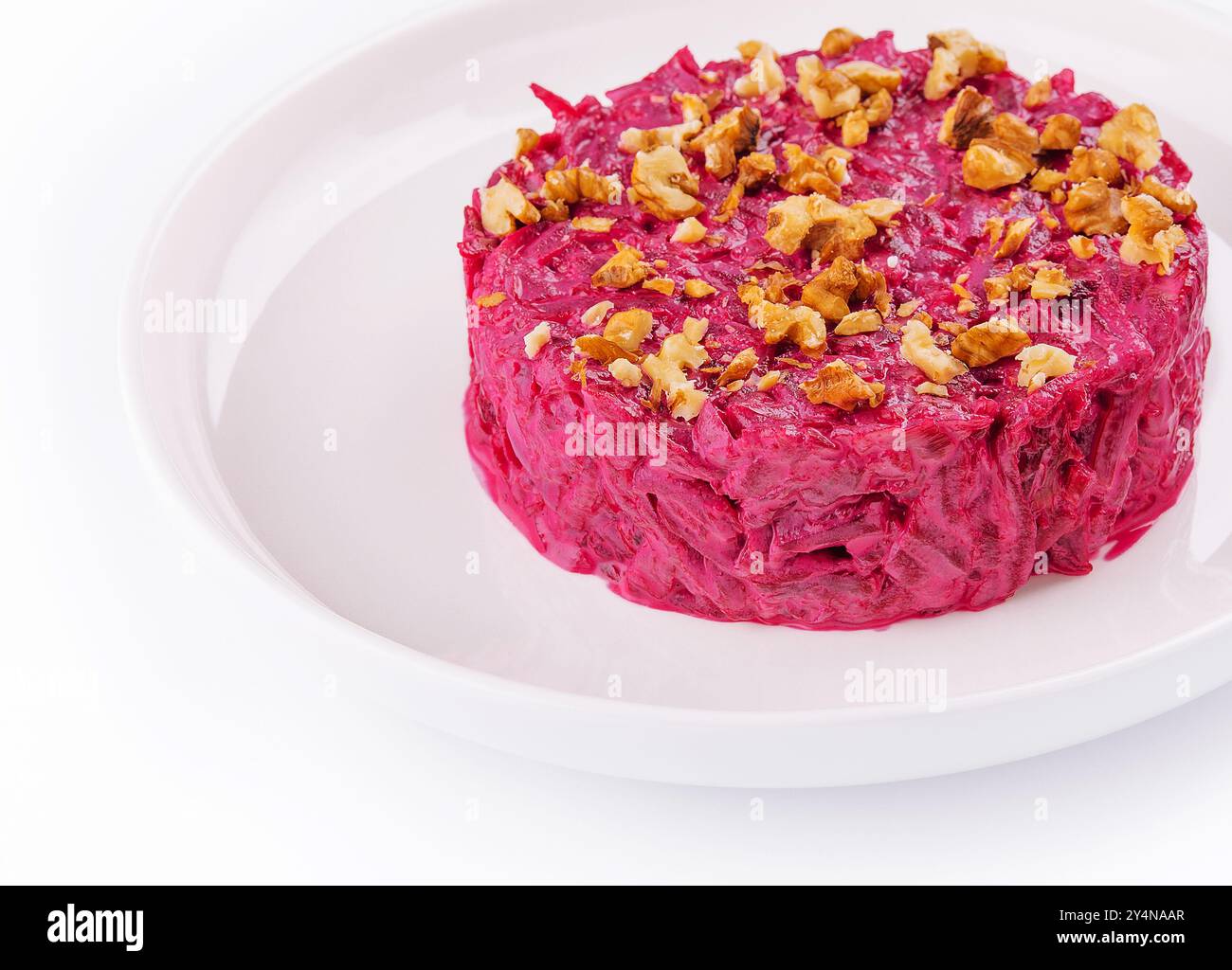 Traditional Beetroot salad with nuts on plate Stock Photo - Alamy