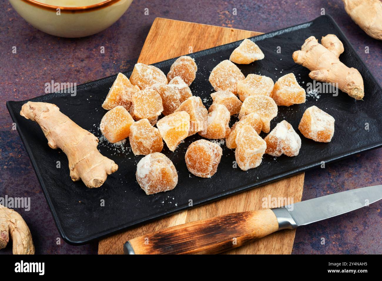 Dried candied ginger pieces and fresh rhizome root, candied ginger ...