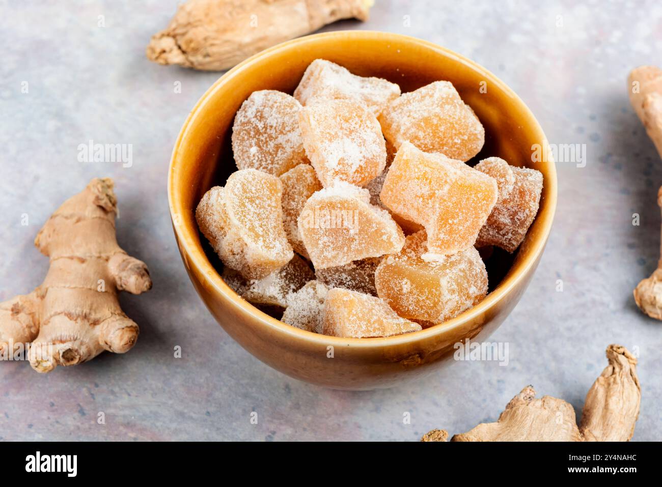 Bowl of candied ginger pieces and ginger roots, candied ginger dessert ...