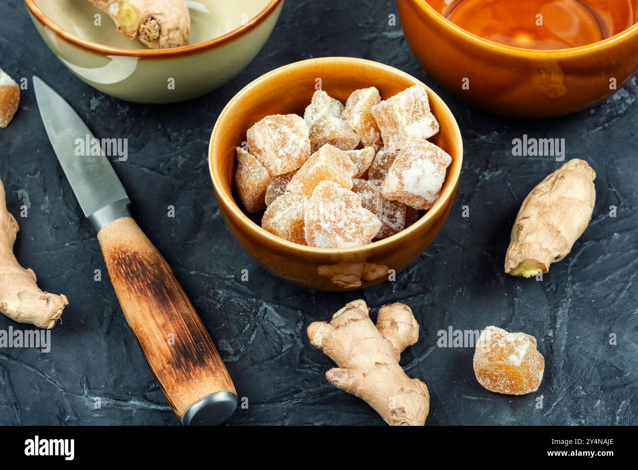 Dried candied ginger pieces and fresh rhizome root, candied ginger ...