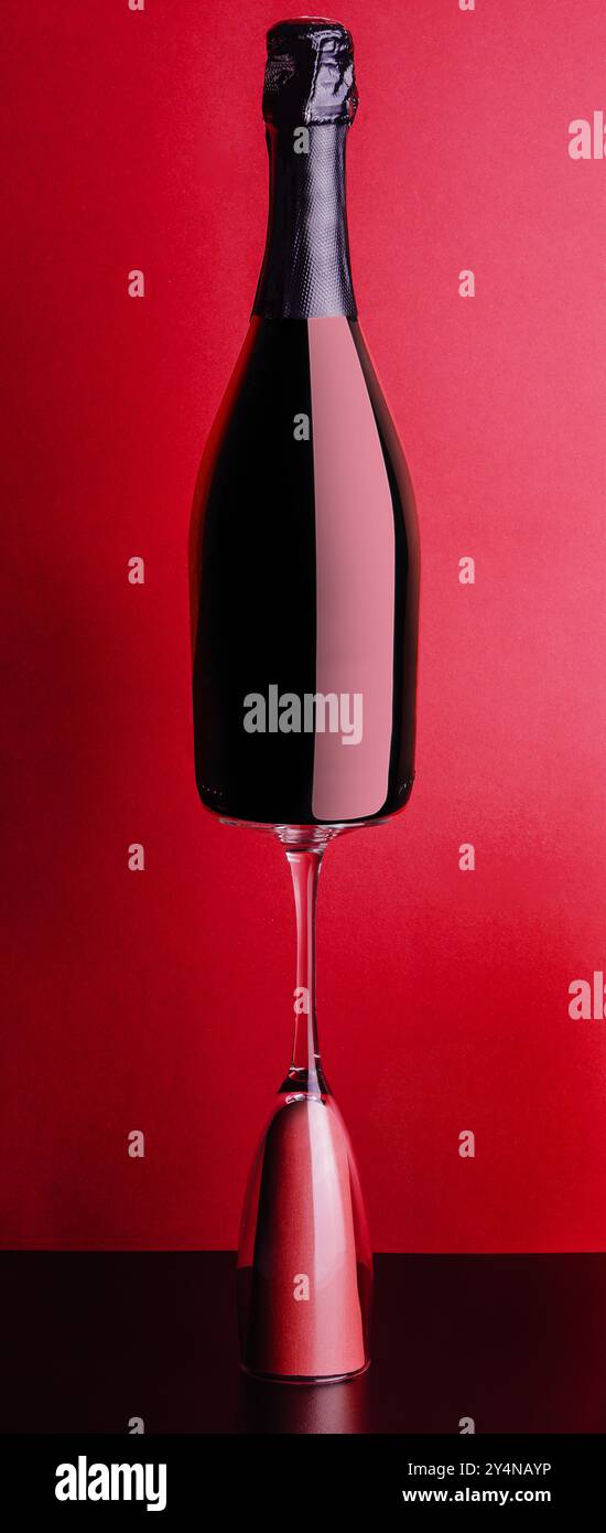 concept of bottle and glass of red champagne Stock Photo - Alamy