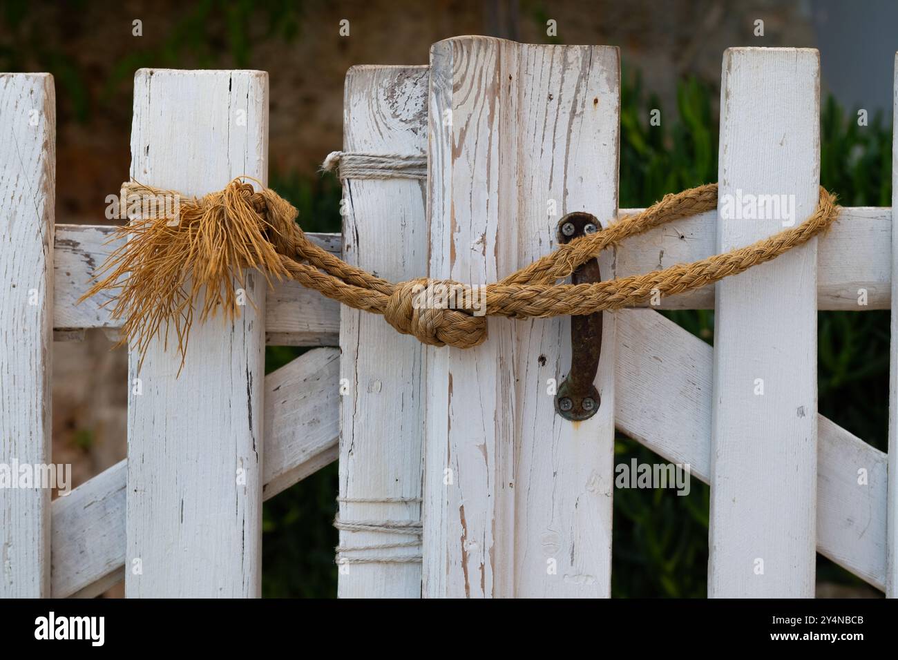 Rope tied to the garden gate Stock Photo - Alamy
