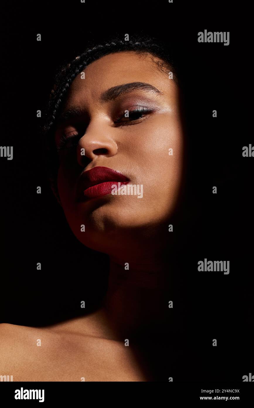 A fashionable young woman confidently poses with braided hair and ...