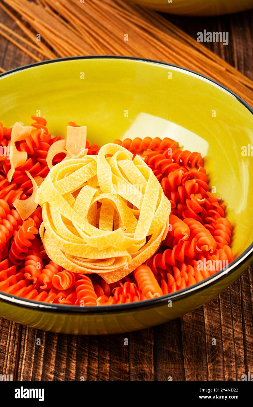 Different types and shapes of pasta, noodles and spaghetti in a bowl ...