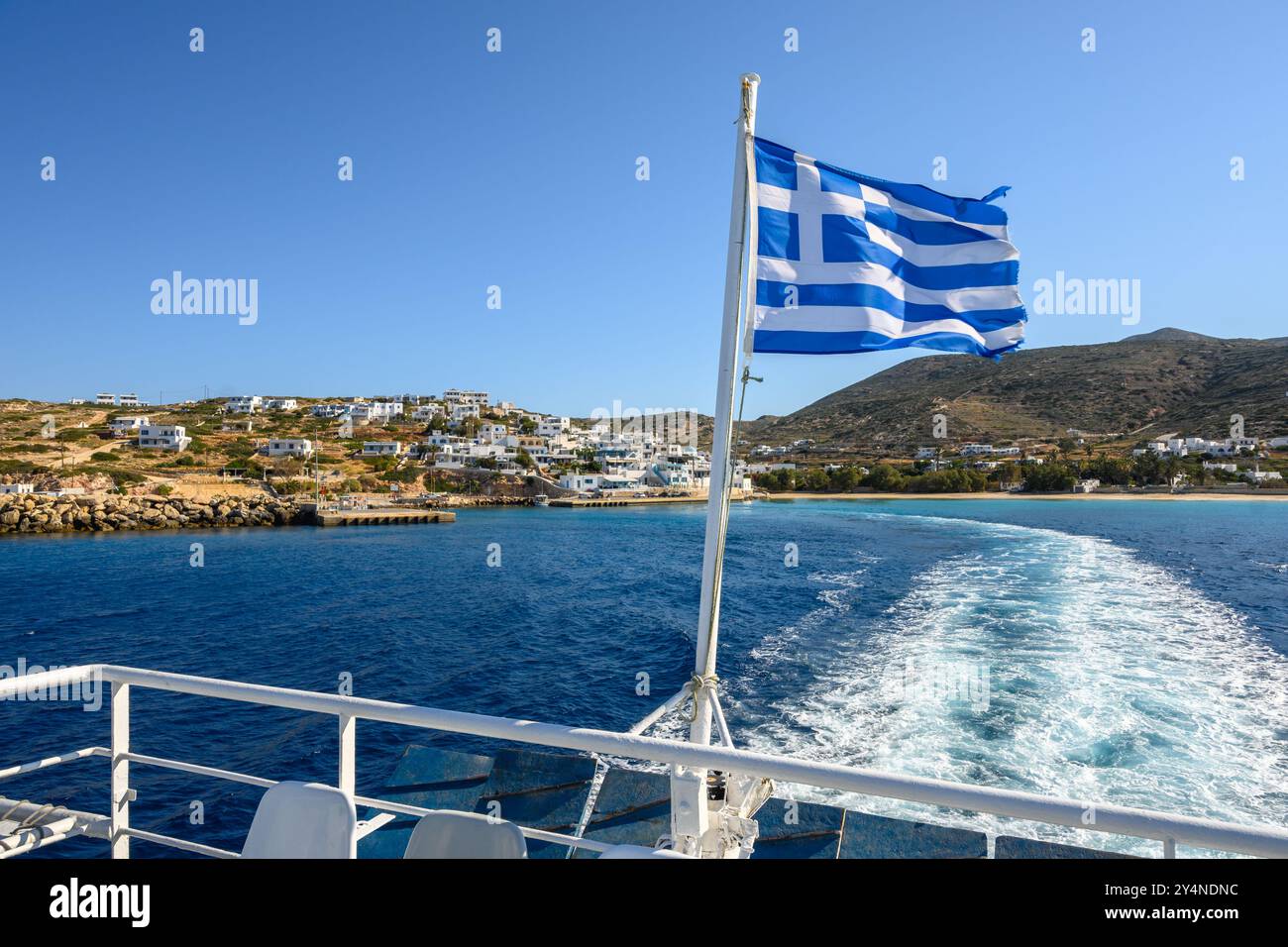 Deck of ferry with Greek flag leaving Donousa island. Cyclades, Greece ...