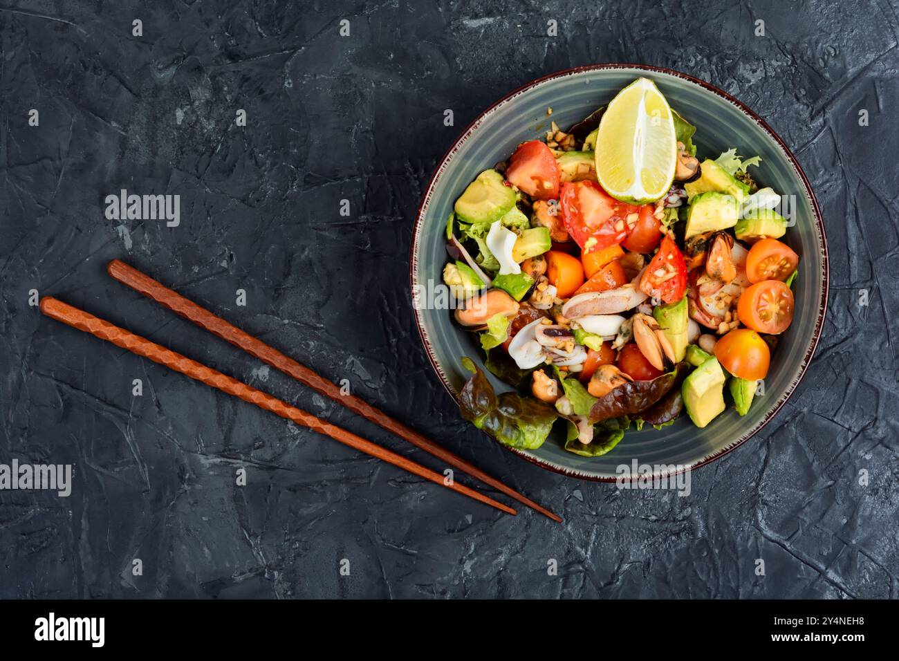 Salad with calamari, shrimp, clams and fresh vegetables. Copy space ...