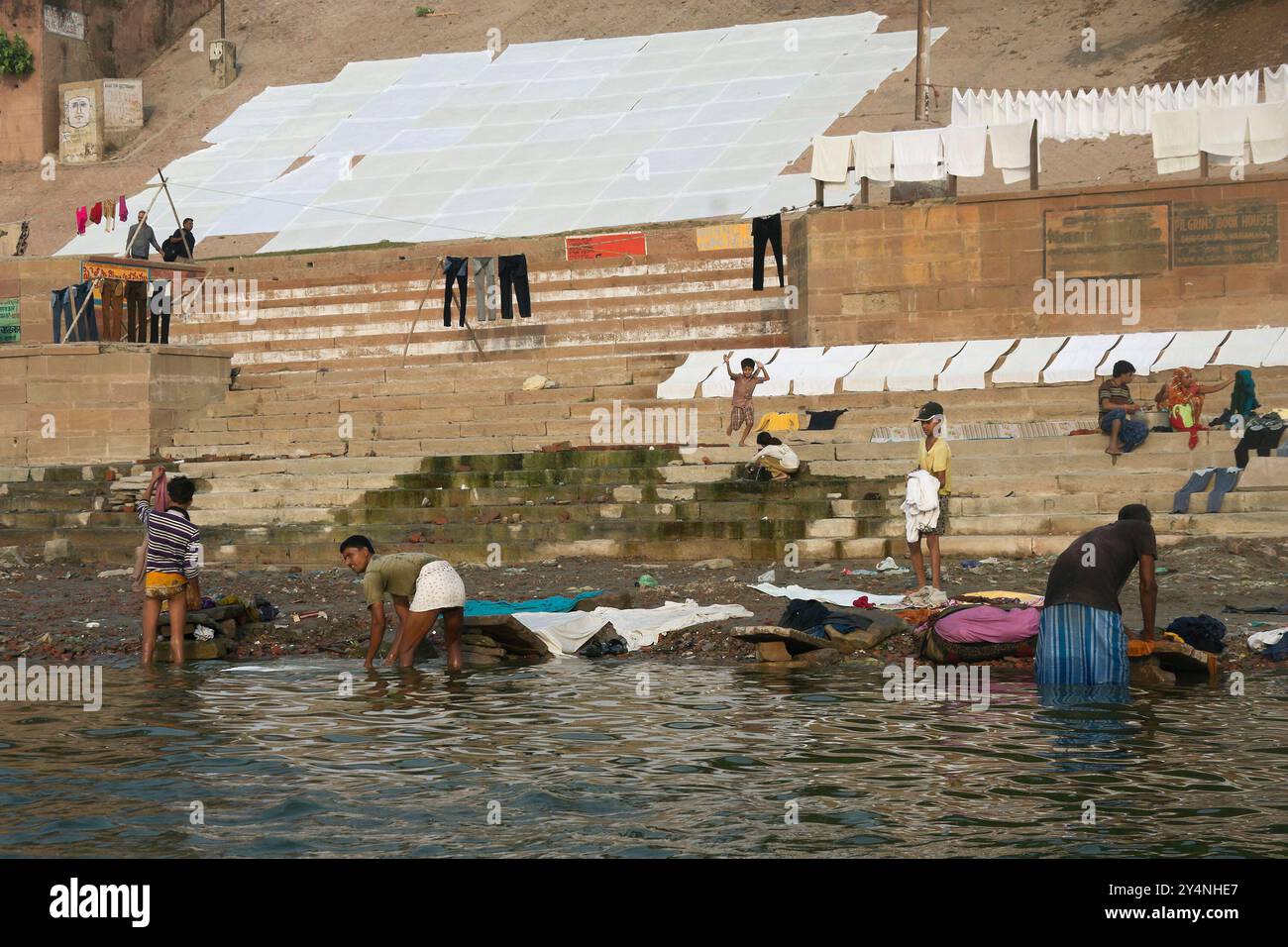 Man washing clothes in the ganges river hi-res stock photography and ...