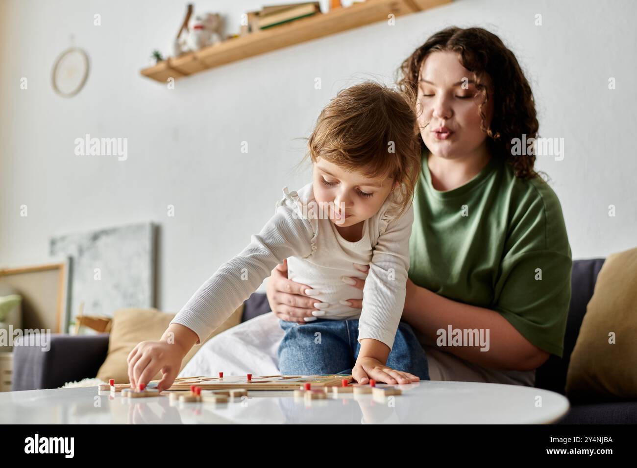A mother enjoys quality time with her daughter, engaging in a fun ...