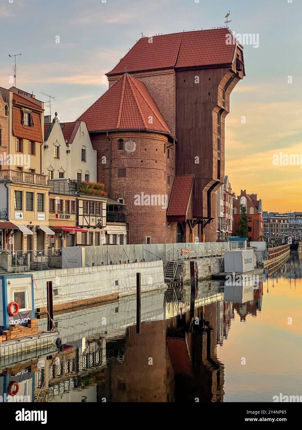 Historic Gdańsk Crane iconic medieval port crane at sunrise, bathed in ...