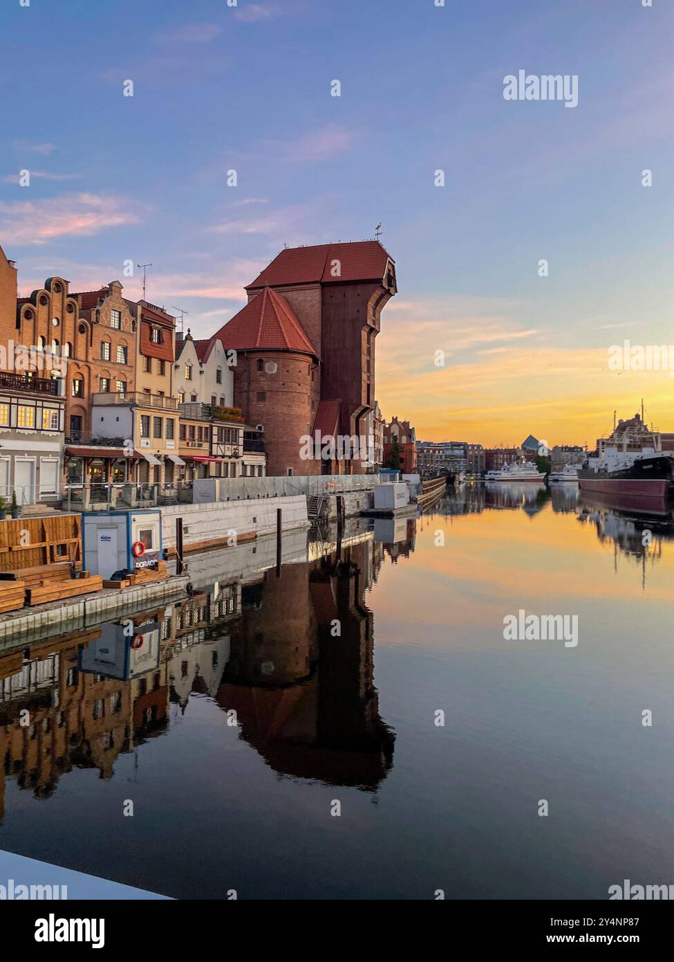 Historic Gdańsk Crane iconic medieval port crane at sunrise, bathed in ...