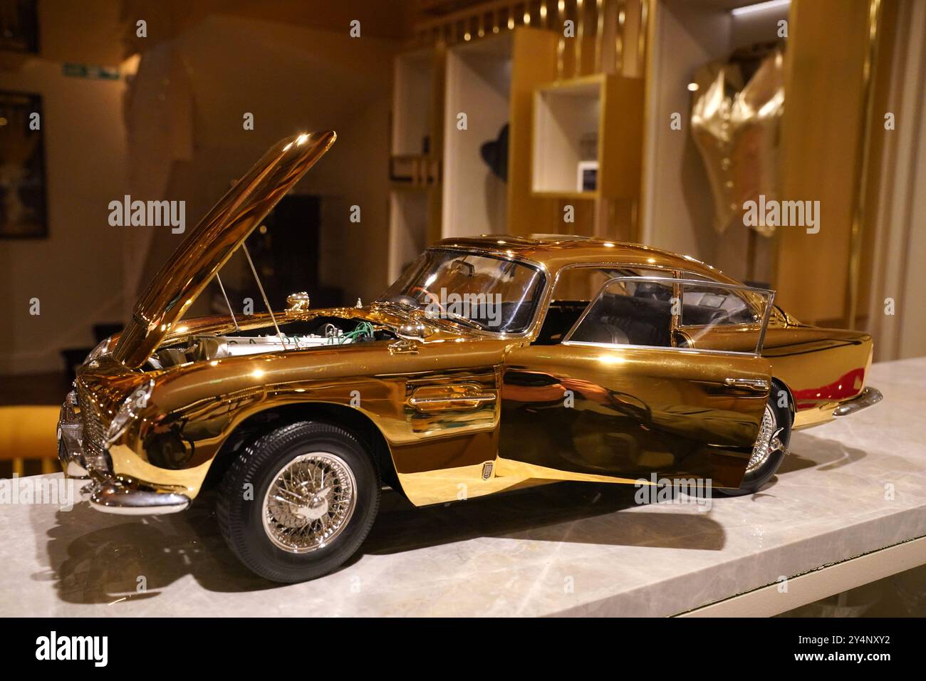 A 24-carat gold-plated model of James Bond's Goldfinger Aston Martin ...