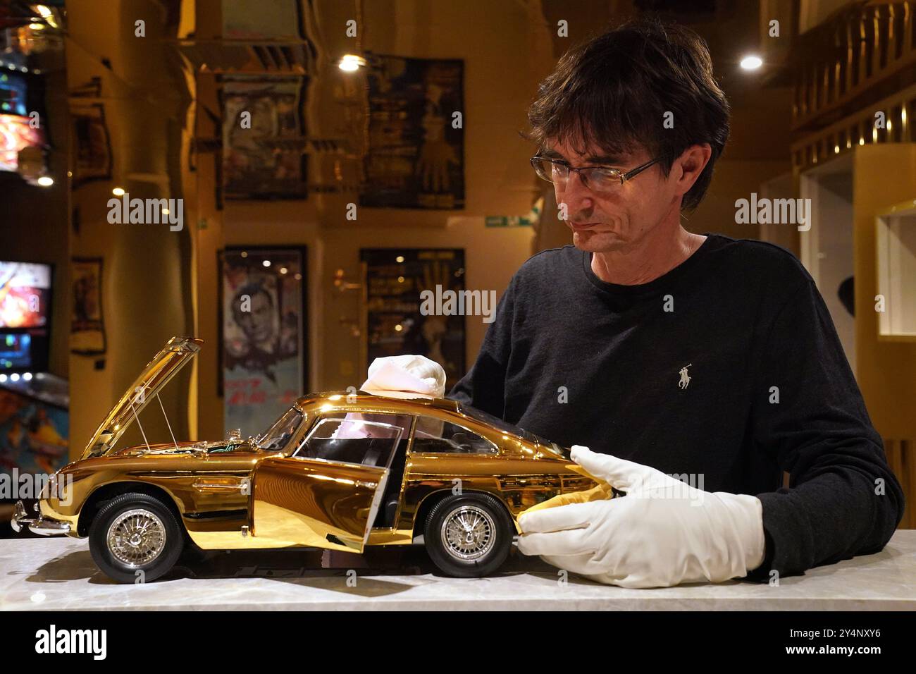 Agora Models CEO James Franks polishing a 24-carat gold-plated model of ...