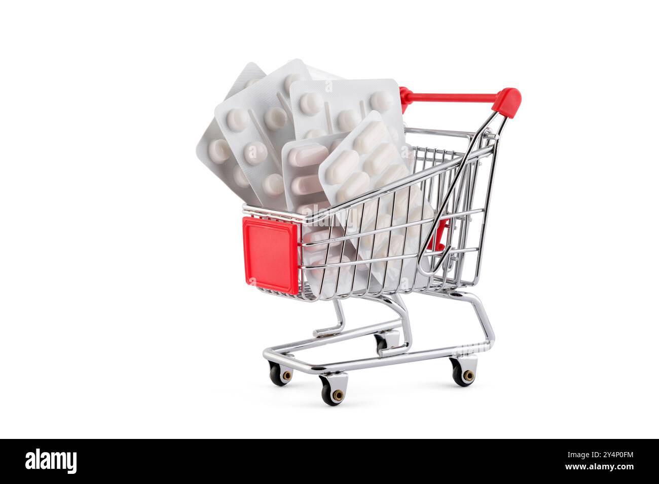 Shopping cart with various medicine pills and tablets isolated on white ...