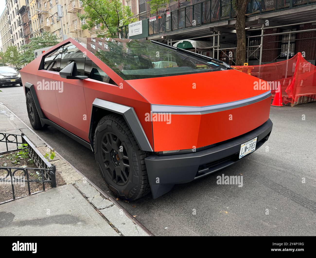 Cybertruck with a burnt orange paint job parked in Manhattan Stock ...