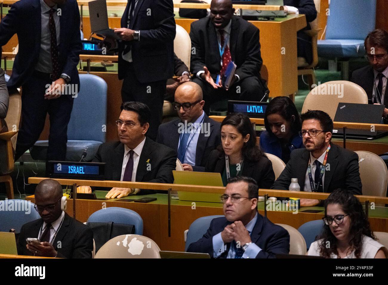 Israel's Permanent Representative to the UN listens as the UN General ...
