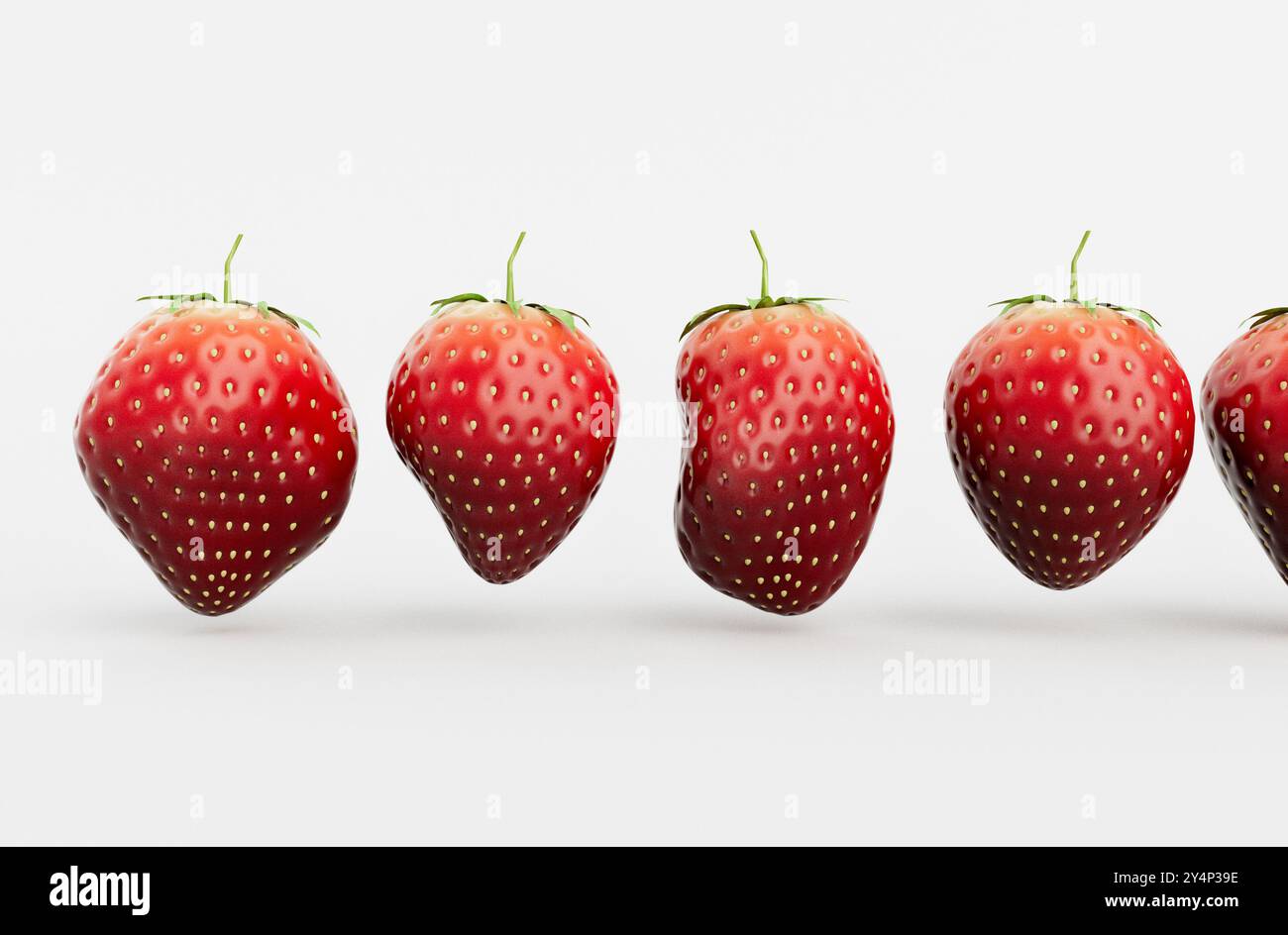 A set of irregular shaped strawberries in a row on an isolated studio ...