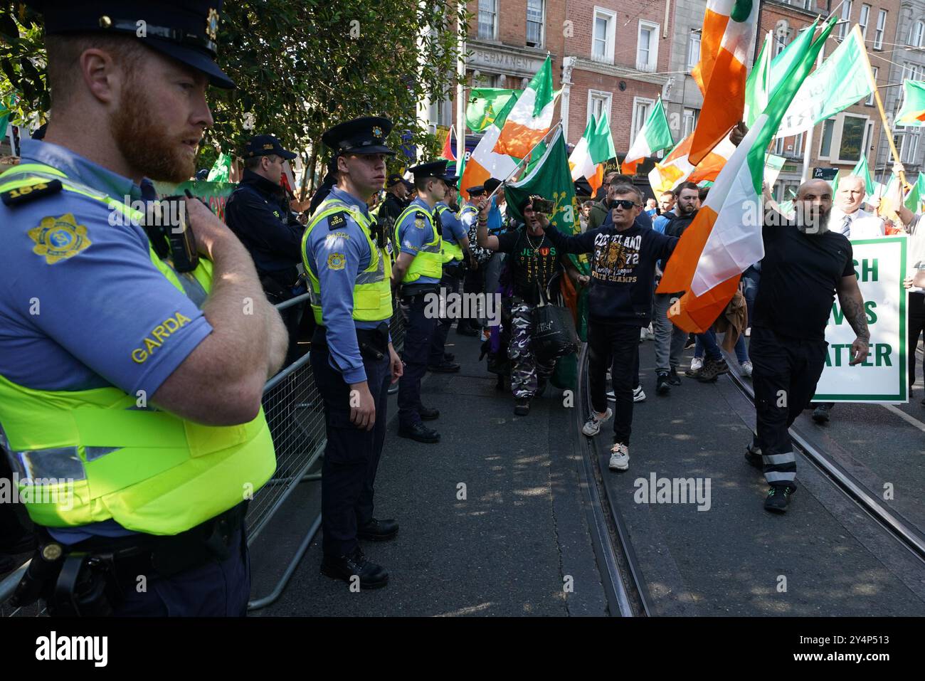Garda form a barrier between protesters and counter protesters in ...
