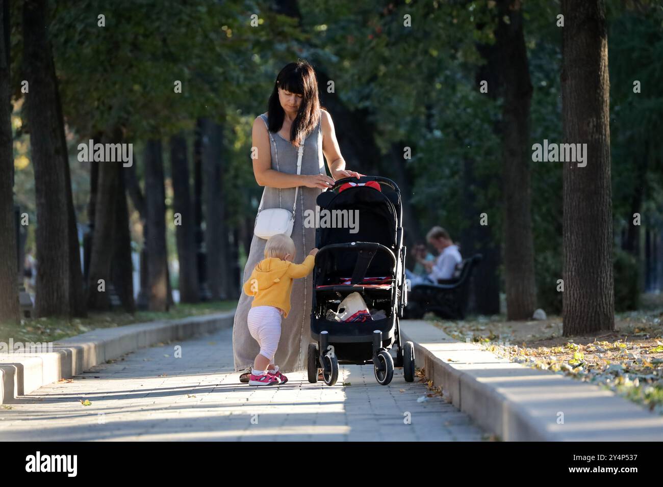 Woman nurse walking in park hi-res stock photography and images - Alamy