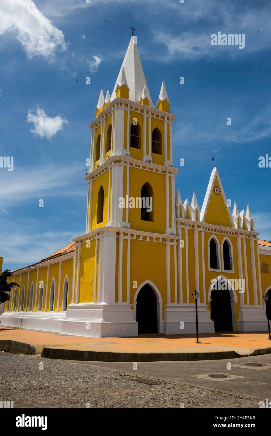 Beautiful South American colonial church with a vibrant yellow façade ...