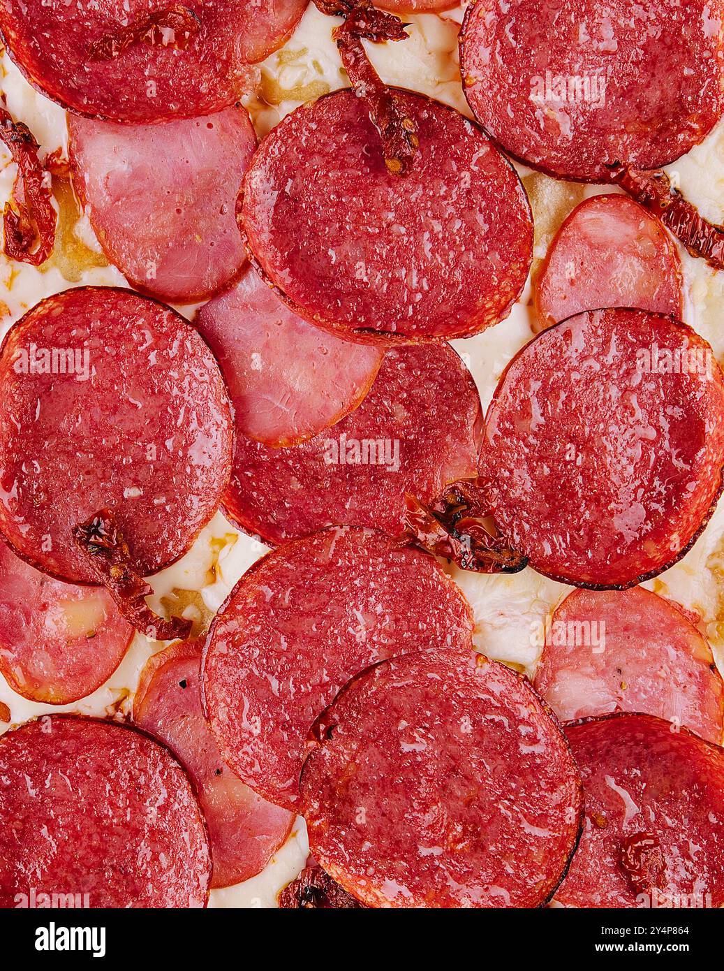 Pepperoni pizza close up background or texture Stock Photo - Alamy
