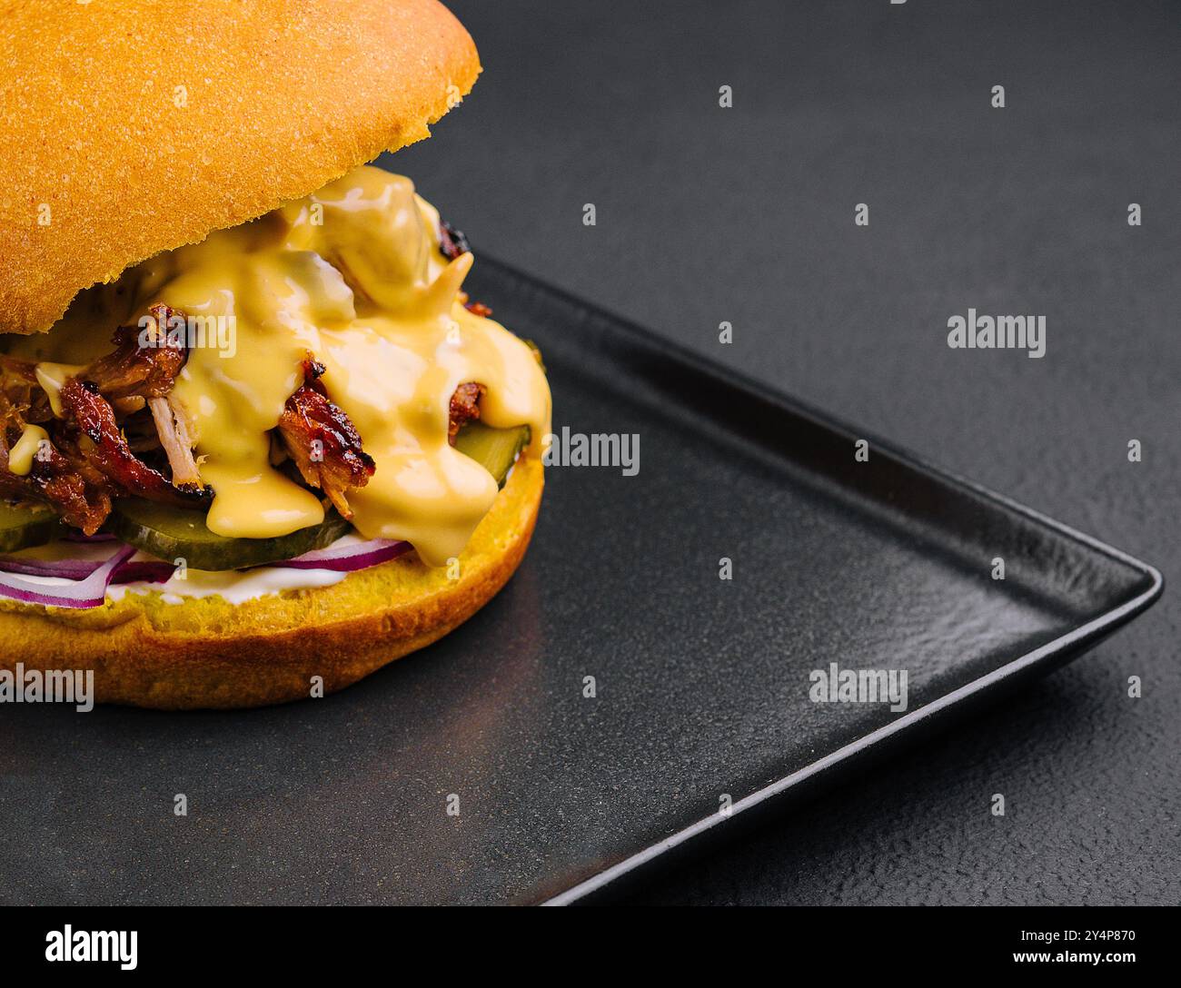 delicious burger with torn meat on black tray Stock Photo - Alamy