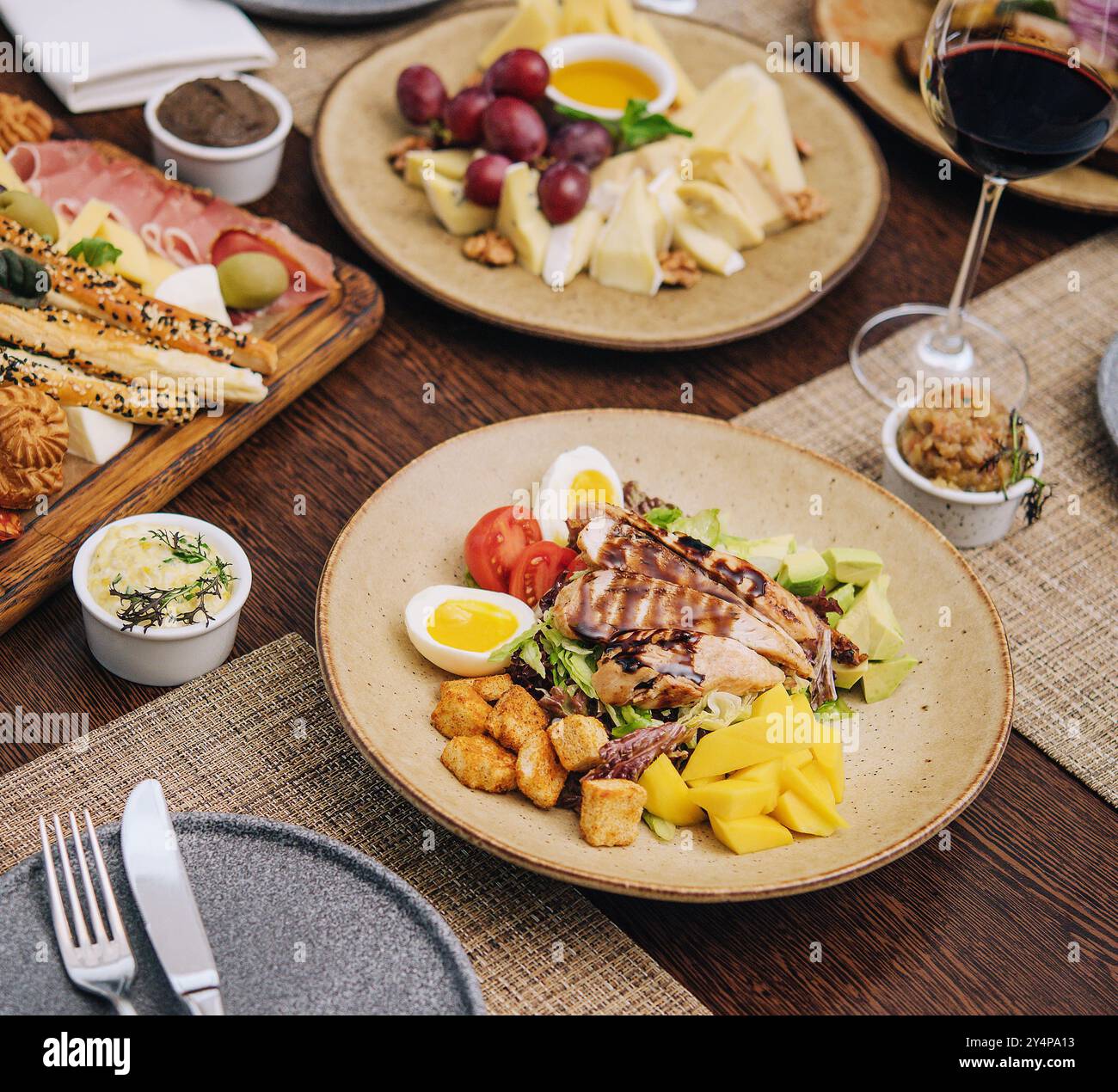 Italian appetizer - various types of ham, cheese and grissini Stock ...