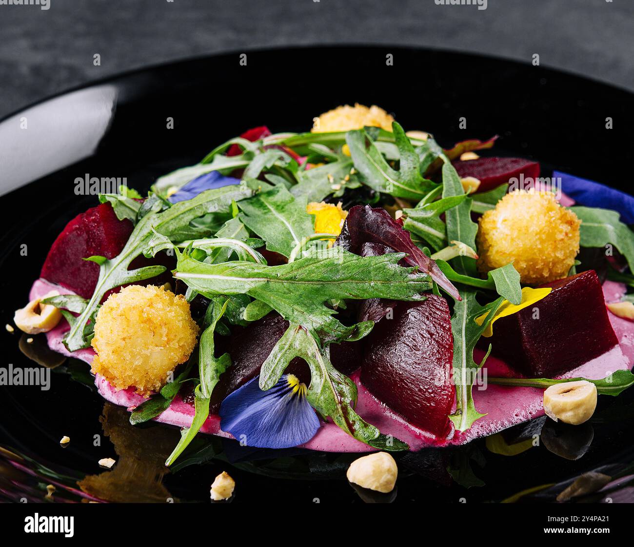 beetroot salad with arugula and cheese balls Stock Photo - Alamy