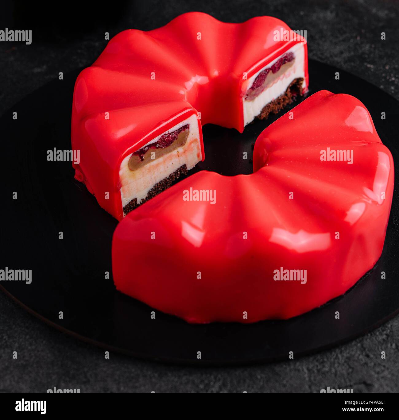 Contemporary Chocolate Cherry Mousse Cake covered with cherry icing ...
