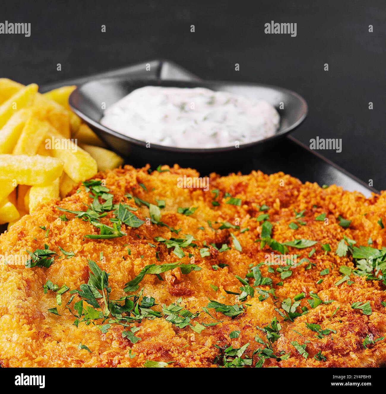 Fried wiener schnitzel from veal topside with french fries Stock Photo ...