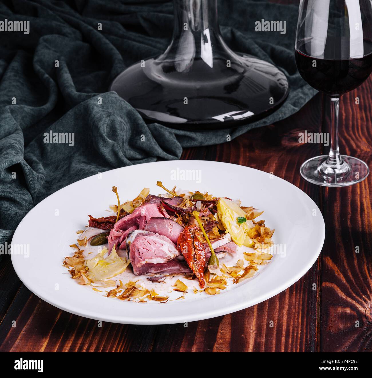 Italian Vitello Tonnato with bottle and glass of wine Stock Photo - Alamy