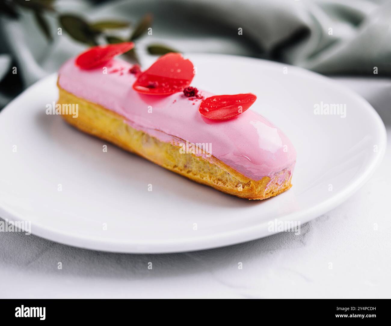 delicious eclairs with pink raspberry glaze Stock Photo - Alamy