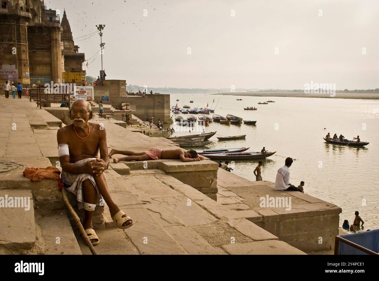 Monsoon rains and pilgrims and cremation rituals by the River Ganges ...