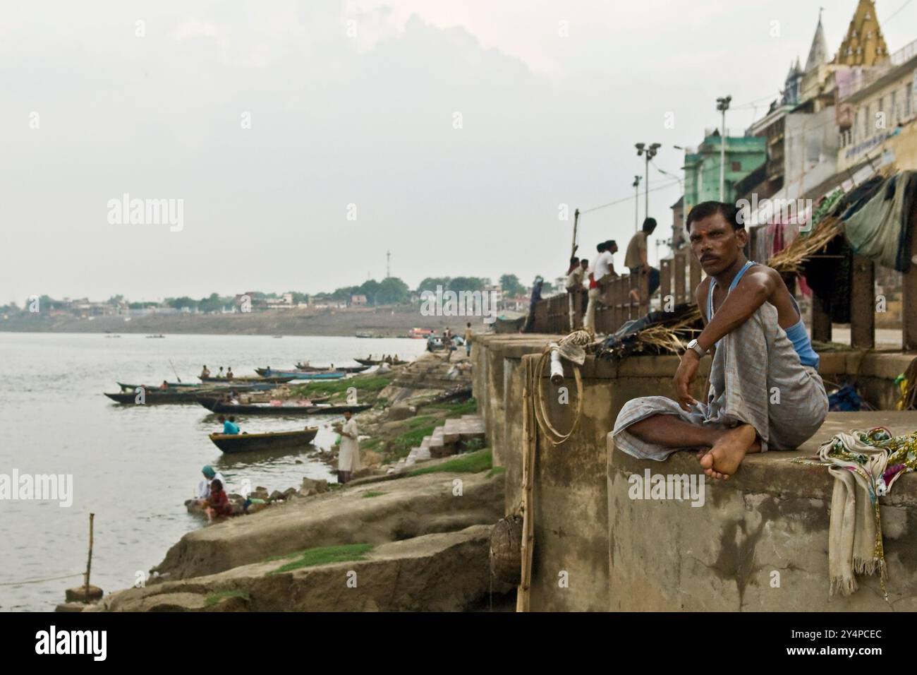 Monsoon rains and pilgrims and cremation rituals by the River Ganges ...