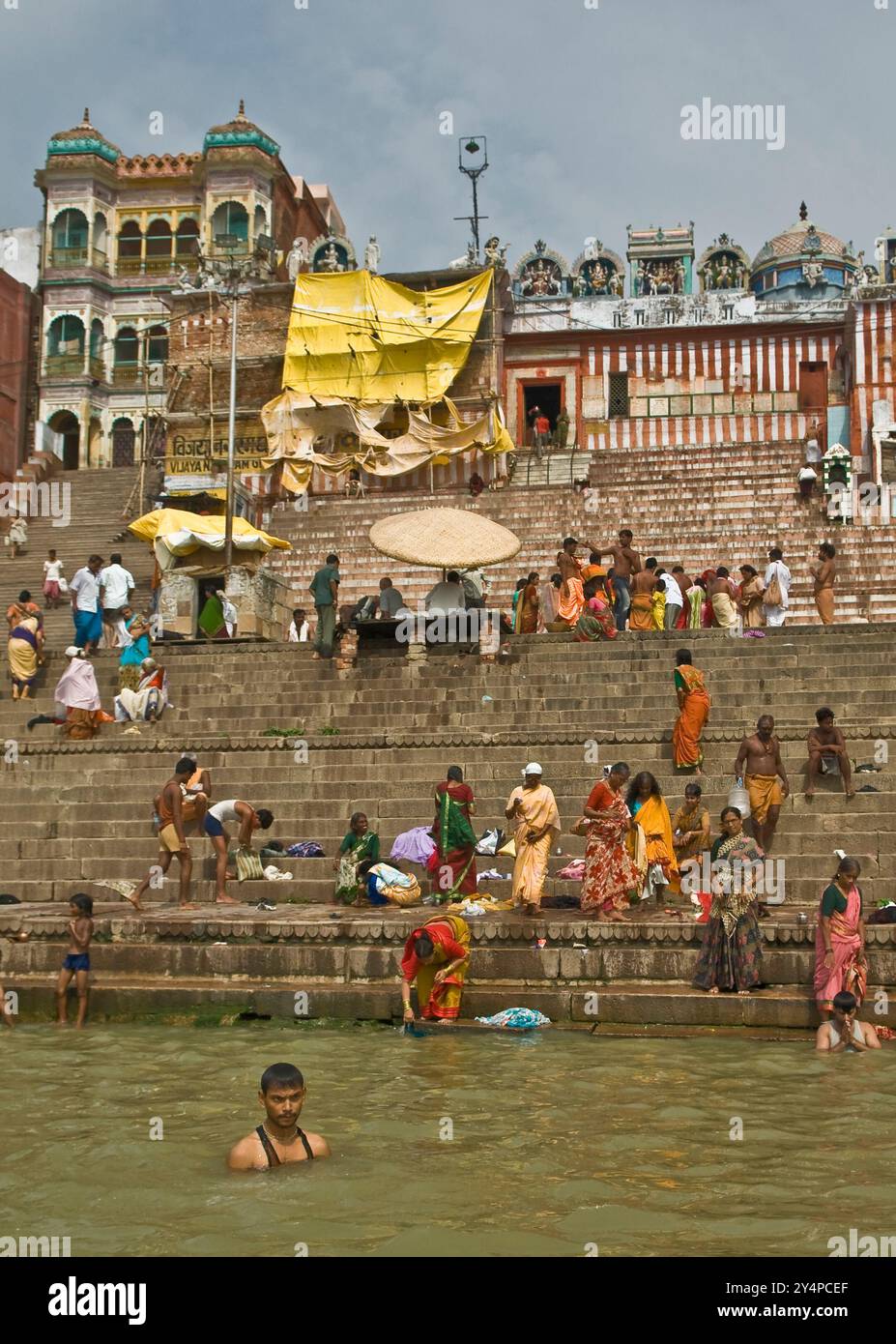 Monsoon rains and pilgrims and cremation rituals by the River Ganges ...