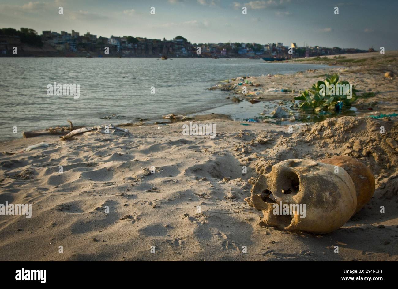 Monsoon rains and pilgrims and cremation rituals by the River Ganges ...