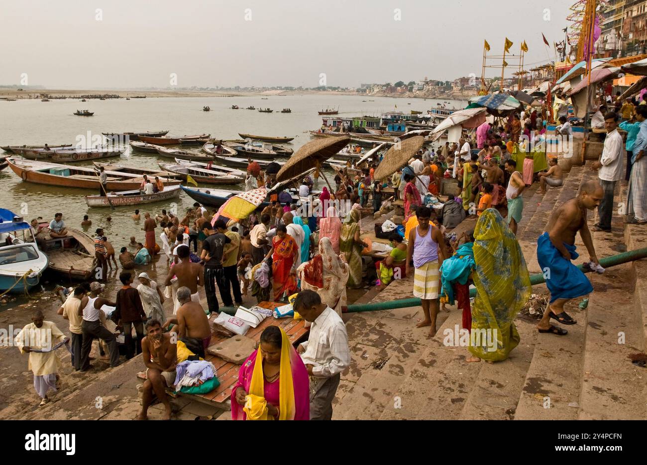 Monsoon rains and pilgrims and cremation rituals by the River Ganges ...