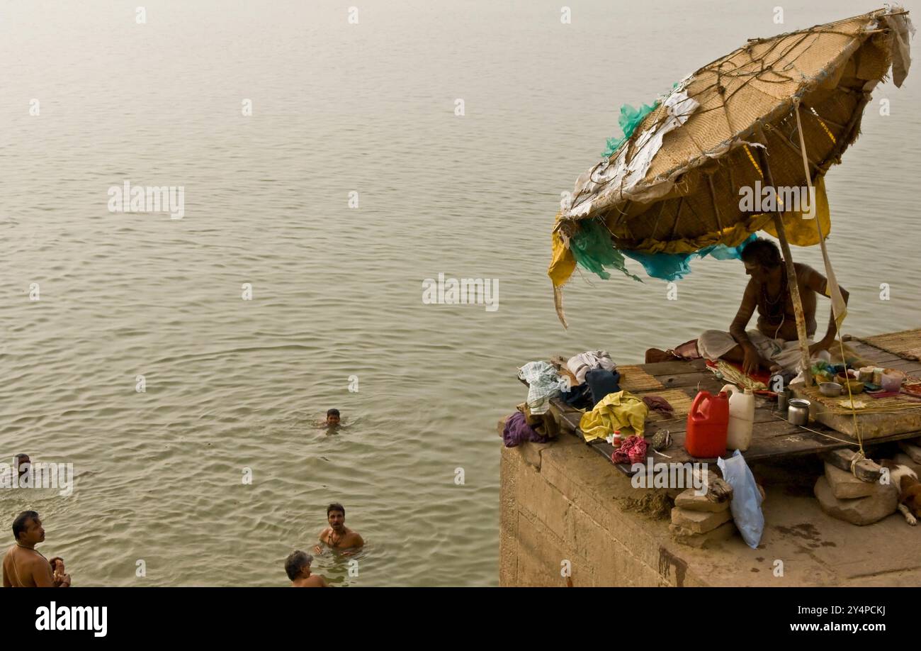 Monsoon rains and pilgrims and cremation rituals by the River Ganges ...